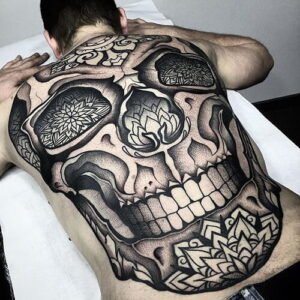 Top 26 Elegant and Badass Skull Back Tattoo Designs for Men